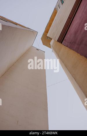 Passage between houses. Corners of two buildings built very close to ...