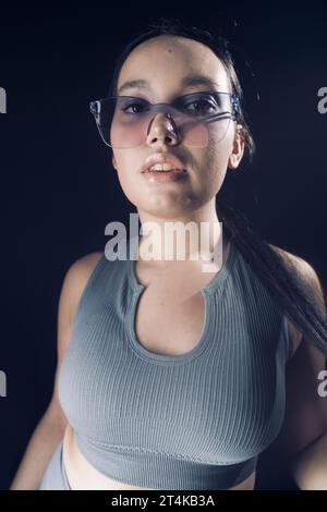 Curvy influencer fitness gym girl posing studio shot Stock Photo - Alamy