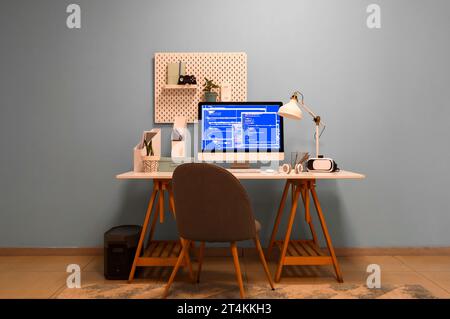 Interior of office with programmer's workplace and pegboard Stock Photo ...