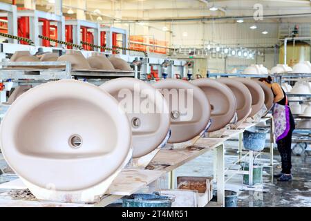 ceramic molding workshop production line in a factory, closeup of photo ...