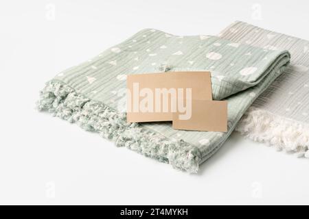Warm cotton muslin blanket with paper tag on white background Stock ...