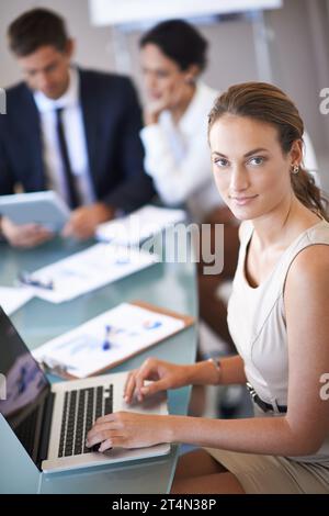 Bring your own device to the workplace. Portrait of a businesswoman ...