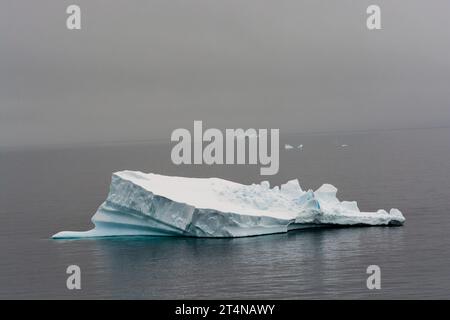 bluish iceberg in icy waters of hughes bay. antarctic peninsula ...