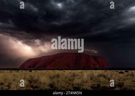 Thunderstorm over Uluru is a rare thing to happen Stock Photo - Alamy