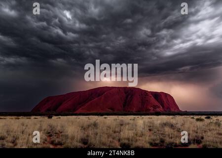 Thunderstorm over Uluru is a rare thing to happen Stock Photo - Alamy