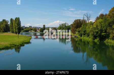 Pjesacki Pontonski Most bridge crosses the Korana River as it passes ...