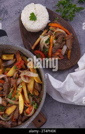 Typical Peruvian food seen from above on dark wooden table Stock Photo ...