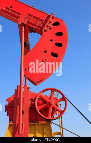 pumping unit mechanical components under blue sky in oilfield Stock ...