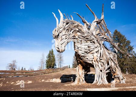 Wooden sculpture of a dragon made of tree branches. Vaia tempest dragon ...