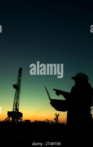 Oil drilling frame and exploration technician in a oilfield Stock Photo ...