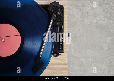Vinyl record player with blue record installed top view white ...