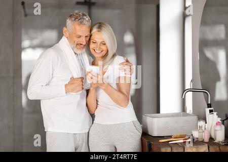 Morning of senior couple in bathroom Stock Photo - Alamy