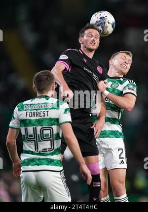 Celtic's James Forrest and St Mirren's Sean Kelly battle for the ball ...