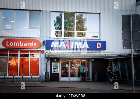 Picture of a sign with a Maxima logo on their local supermarket in Riga ...