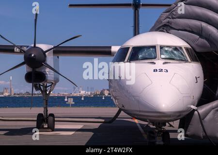 Front view of white modern turboprop airliner with close-up of pointed ...