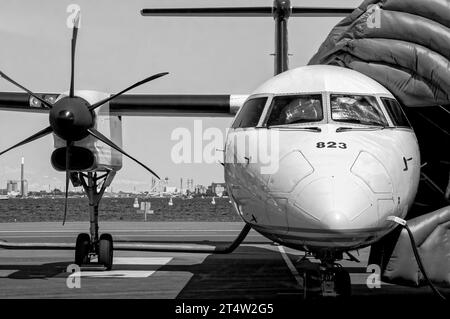 Front view of white modern turboprop airliner with close-up of pointed ...
