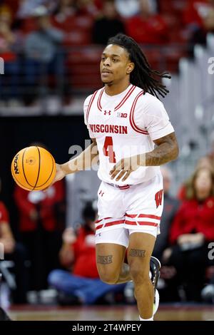 Wisconsin guard Kamari McGee (4) dribbles during the second half of an ...