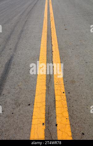 Yellow double solid line Stock Photo - Alamy