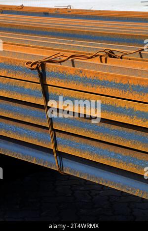 steel plate banding piled up together, closeup of photo Stock Photo - Alamy