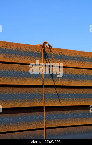 steel plate banding piled up together, closeup of photo Stock Photo - Alamy