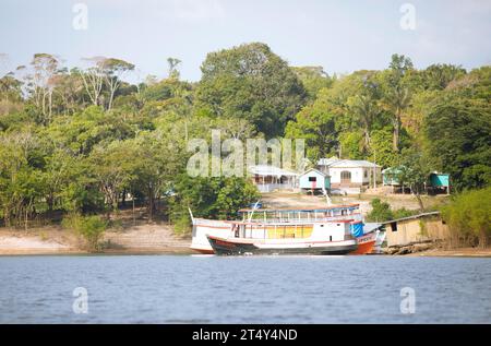 Boats on the Rio Amazonas at low water level, Amazonas state, Brazil ...