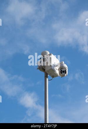 Local authority CCTV street surveillance cameras mounted at height on ...