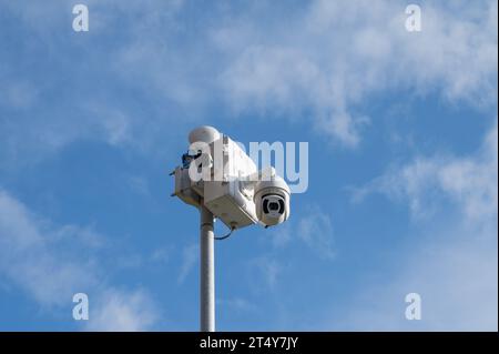 Local authority CCTV street surveillance cameras mounted at height on ...