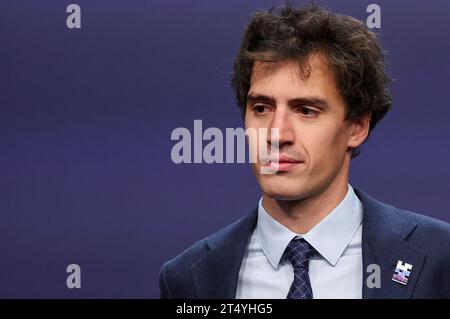 Arthur Mensch, CEO of Mistral AI, carries a cup at Station F, during an ...