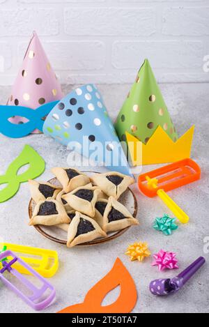Purim celebration concept (jewish carnival holiday) over wooden table ...