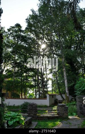 A beautiful monastery in the background of an alley with street lamps ...