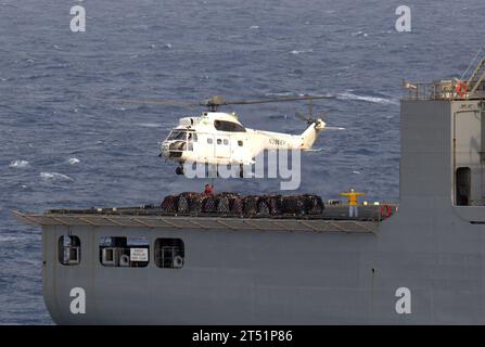 A civilian mariner on the USNS Alan Shepard (T-AKE 3) clears the ...