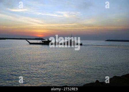 An Improved Navy Lighterage System (INLS) causeway ferry approaches the ...