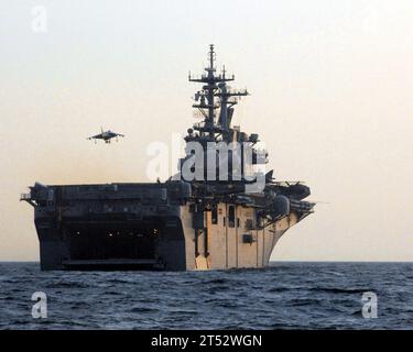 An AV-8B Harrier from HMM-266 lands on USS Wasp (LHD 1) flight deck ...