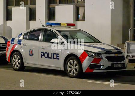 A Singapore Police Station with a parked Police Car at night Stock ...
