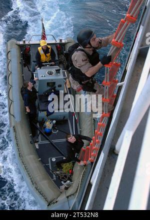 Crew members aboard the guided missile cruiser USS BELKNAP (CG 26 ...