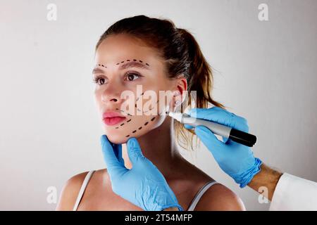 Facial Aesthetics Facelift. Plastic Surgery Drawings On Face Stock ...