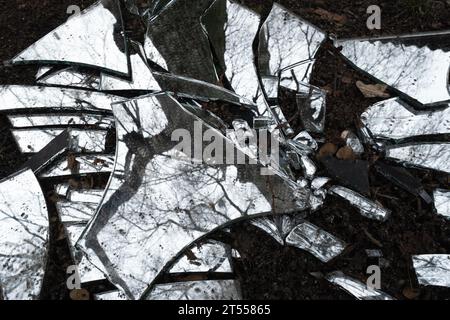 Top view of pile of broken uneven sharp edges of mirror glasses with ...