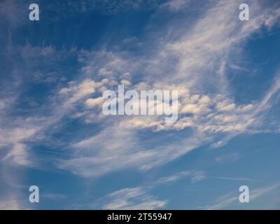 Blue sky with unusual abstract white clouds. Strange dramatic clouds ...