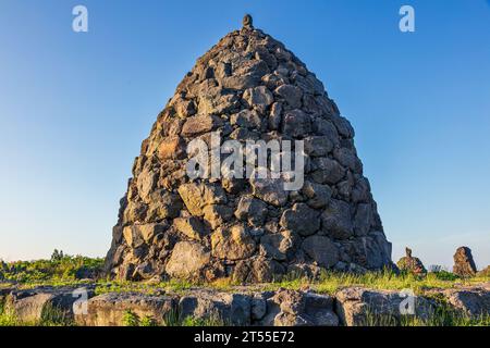 Dol hareubang (grandfather stone) volcanic rock statues along the Jeju ...