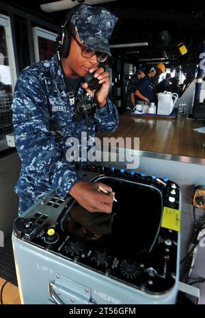 Sailor, sound powered phone, U.S. Navy, USS Pearl Harbor (LSD 52 Stock ...