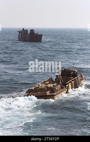 A landing craft utility and lighter amphibious re-supply vessel conduct ...