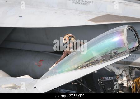 US Navy A plane captain cleans the canopy of an F-A-18C Hornet Stock ...