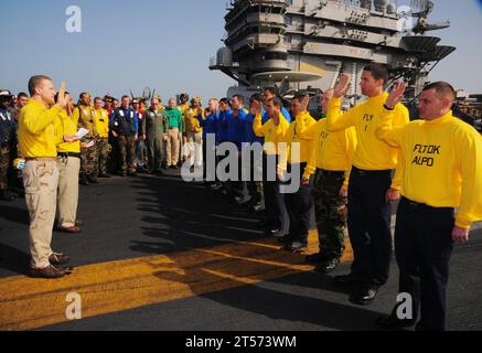 US Navy A flight deck officer signals as an EA-6B Prowler launches from ...