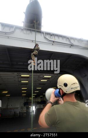 U.S. Marines conduct fast roping out of a V-22 Osprey on Camp Sendai ...