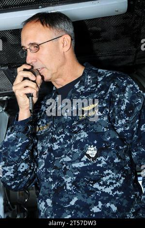 A U.S. Navy commander addresses his crew during the closing ceremony of ...