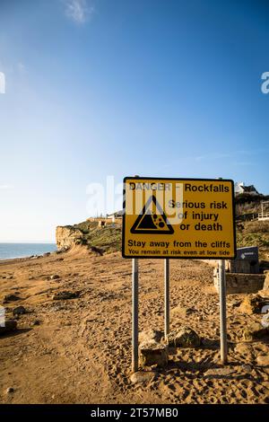 Coastal erosion sign on Jurassic Coast at Seaton Devon England UK Stock ...