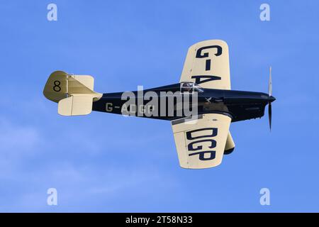 A 1930's Miles Hawk Speed 6 racing aircraft in formation with a Travel ...