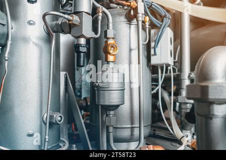 Industrial equipment with pneumatic valves, hoses, and gauges ...