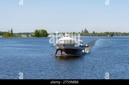 Tourist motor ship Meteor hydrofoils floating on Lake Onega against the ...