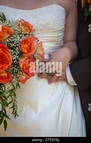 Pregnant bride with the groom on their wedding day Stock Photo - Alamy